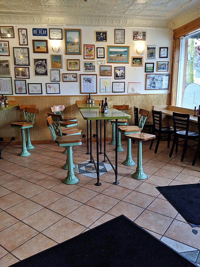 The dining area tells stories through its wall of memories. Each framed piece is a chapter in Blimpy's ongoing love affair with Ann Arbor.