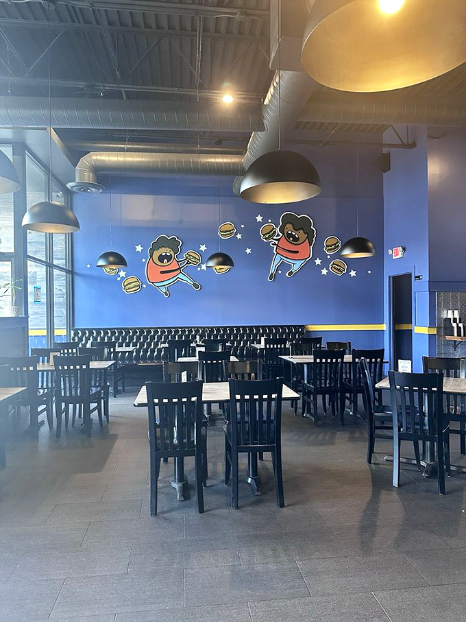 The dining room's playful burger-themed wall art reminds you that serious food doesn't have to take itself too seriously.