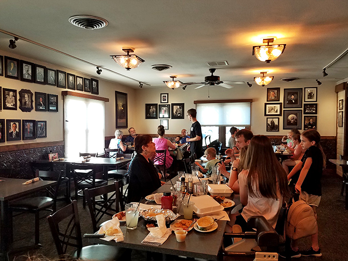 The dining room buzzes with multi-generational gatherings, where smartphones stay pocketed and actual conversation flows as freely as the iced tea.