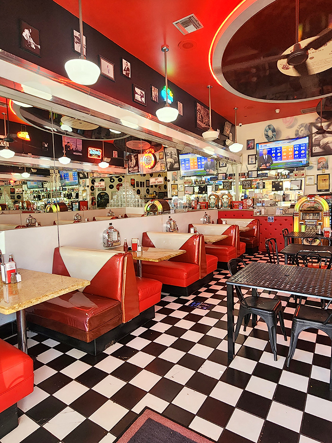 Red booths lined up like classic Chevys at a drive-in, each one a front-row seat to the greatest show on plates.
