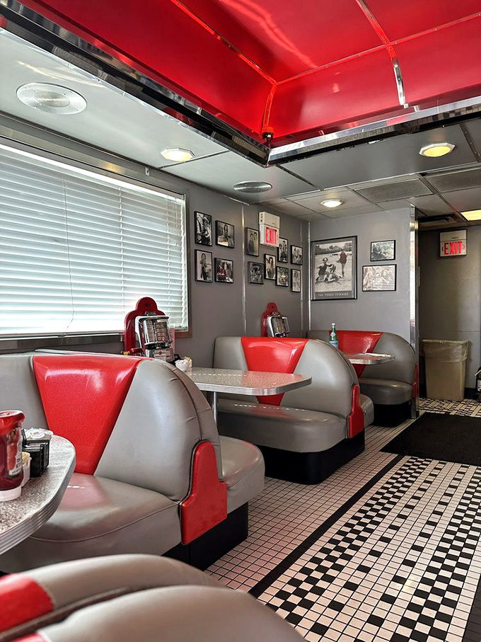 Red and gray booths invite you to slide in and stay awhile, surrounded by black-and-white memories of a simpler time.