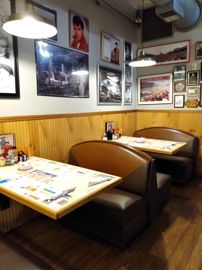 Classic diner seating where strangers become friends over shared appreciation for perfectly cooked hash browns and conversation.