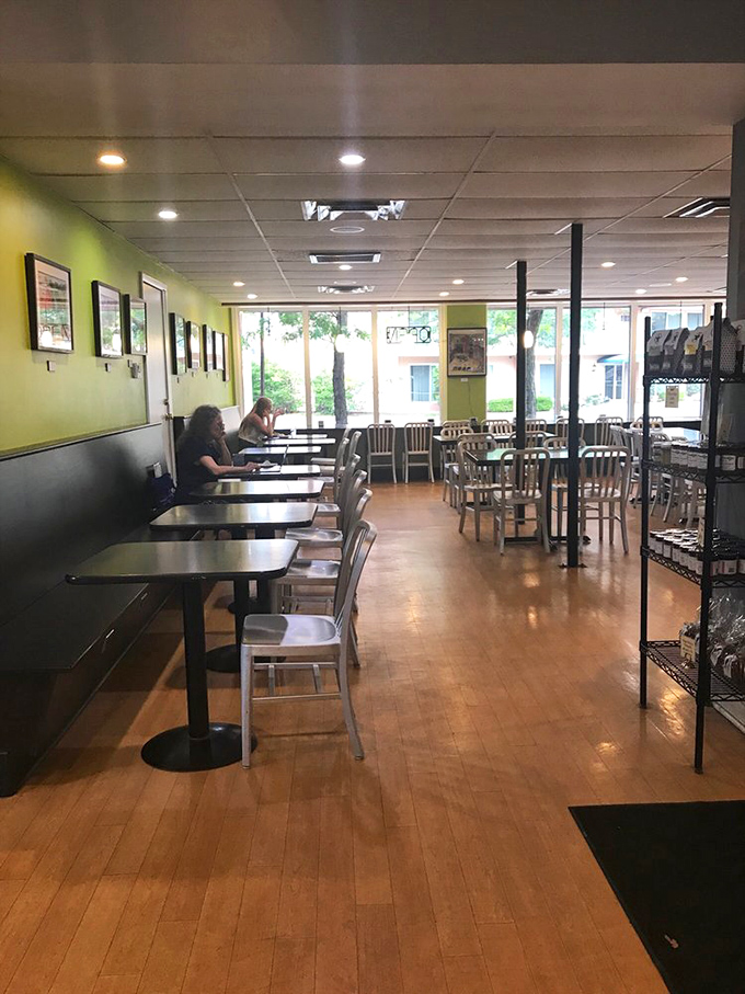 The bakery's minimalist seating area, where strangers become temporary friends united by the universal language of "mmm" and "you have to try this."