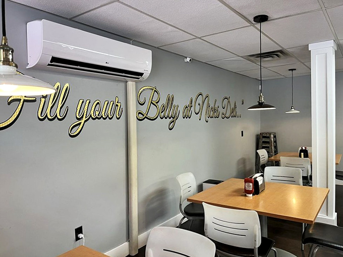 Modern minimalism meets deli charm. The gold script on the wall reminds you of your mission: arrive hungry, leave with your belly properly filled. 