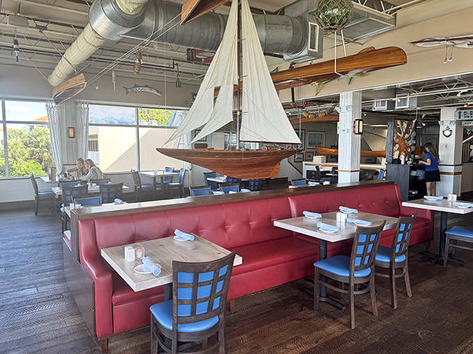 The dining room manages that rare feat of being both nautically themed and genuinely stylish, with those red booths serving as the restaurant's signature.