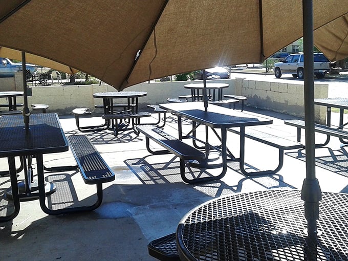 Outdoor seating where Arizona sunshine meets culinary bliss. Simple picnic tables that have witnessed countless "Oh my God" first-bite moments.