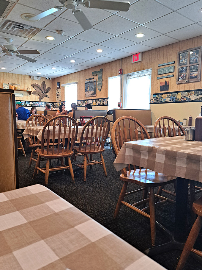 A dining room where conversations flow as freely as the coffee. Those wooden chairs have supported generations of satisfied customers.