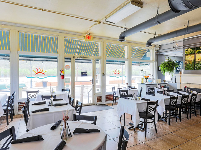 Sunshine streams through windows in this dining room where every table feels like the best seat in the house.