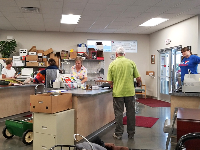 The checkout area bustles with activity as treasures find new homes. That green shirt might become someone's "lucky interview outfit" by tomorrow morning.