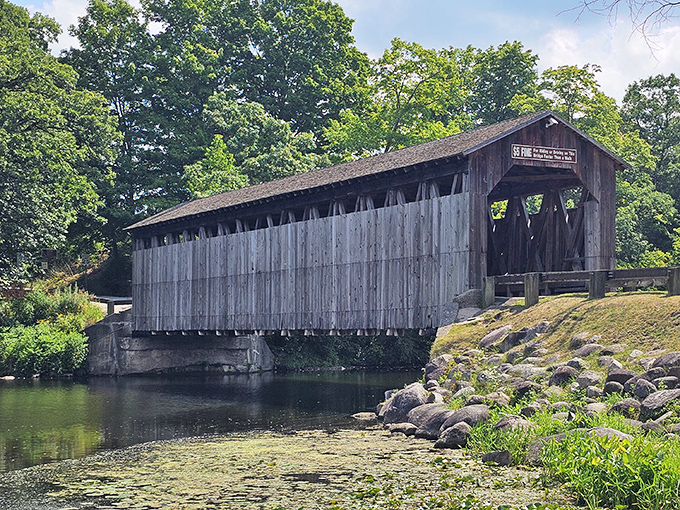 Side view splendor! The weathered wooden exterior shows its age proudly, like wrinkles on the face of a beloved grandparent with stories to tell.