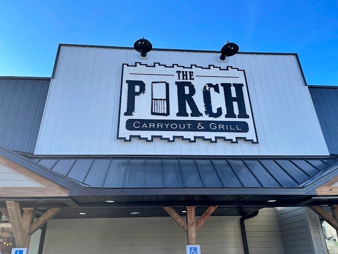 The Porch's distinctive signage stands out against the blue Ohio sky, a beacon for hungry travelers and locals alike.