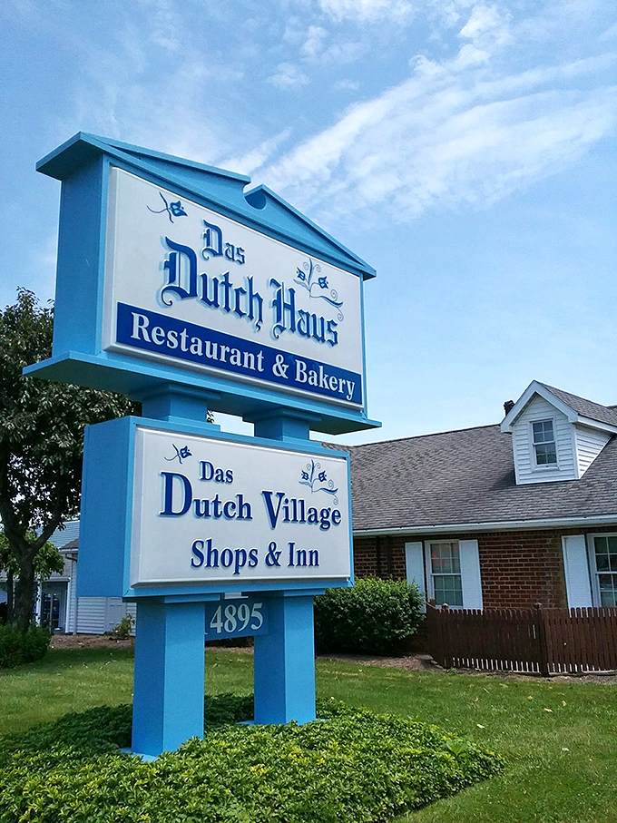 Bold blue signage announces your arrival at a destination where pies have achieved legendary status among locals.