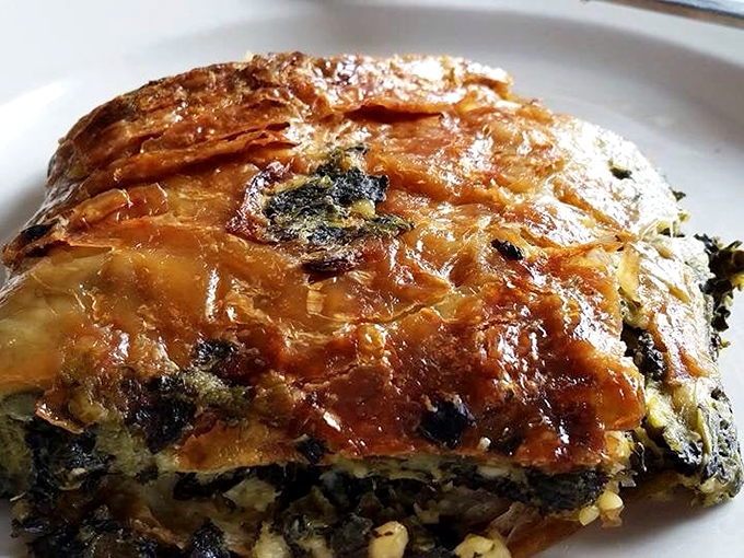 This isn't just spinach pie&mdash;it's a golden-crusted treasure chest filled with savory delights that would make Popeye weep with joy.