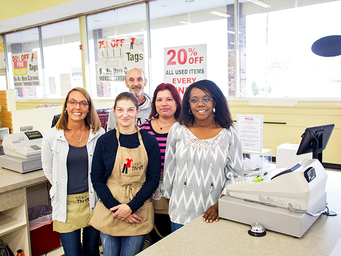 The friendly faces behind the treasure trove. These thrift wizards know exactly where that vintage lamp you're seeking might be hiding.