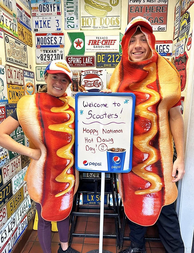 The staff in hot dog costumes celebrates National Hot Dawg Day with the kind of enthusiasm that makes you want to join their delicious cult.