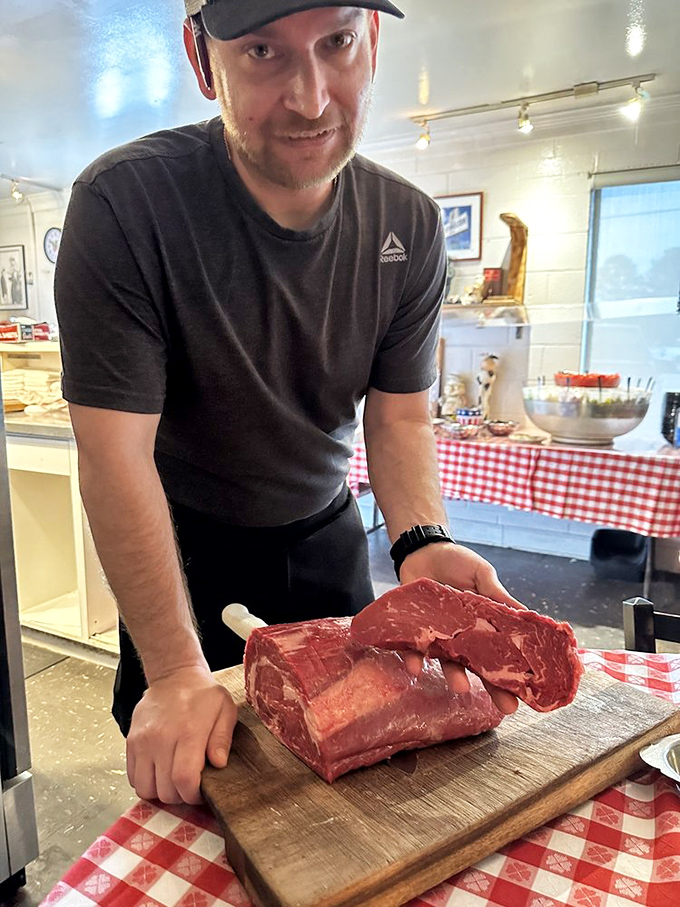The steak whisperer presents his canvas of marbled perfection, a craftsman who understands the sacred relationship between beef and fire.