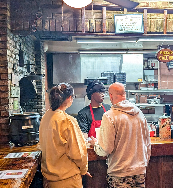 The sacred exchange: order placed, anticipation building. That knowing look from the staff says, "Just wait till you taste this."