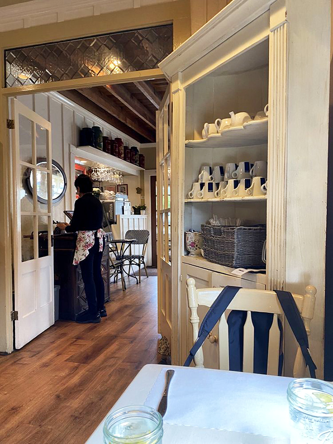 Glimpses into the working heart of the cafe, where white teacups stand at attention, ready for their moment to shine.