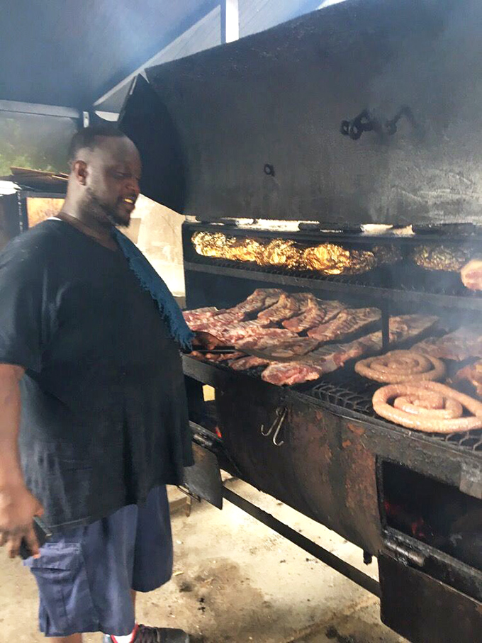 The pitmaster at work, orchestrating the dance between fire, smoke, and meat with the confidence that comes from true expertise.