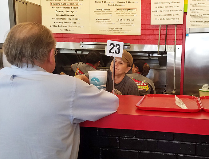 The pickup window: where breakfast dreams come true and order numbers become the most important digits in your morning.