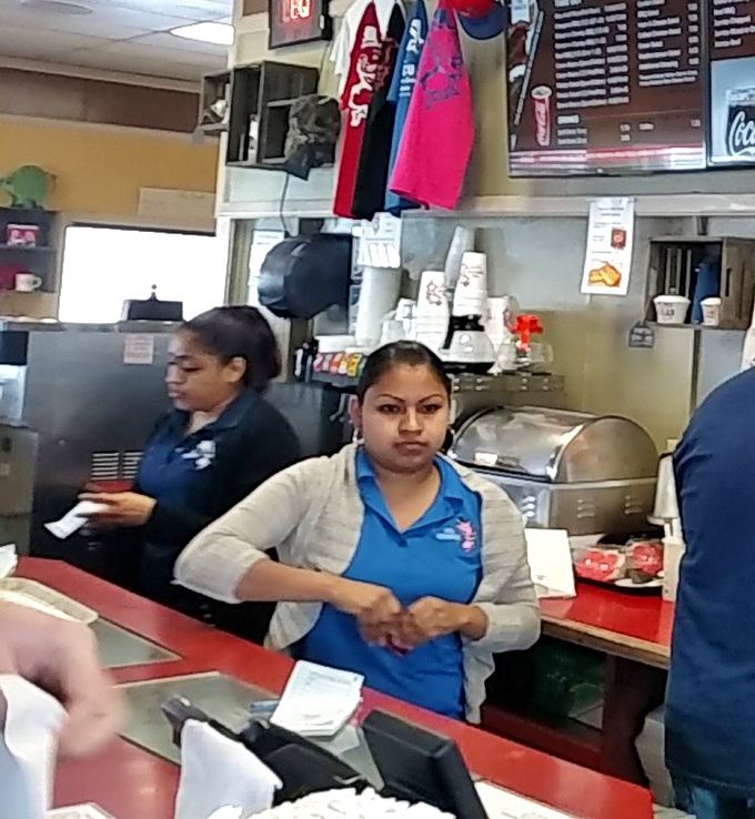 Where the magic happens: dedicated staff keeping the BBQ flowing and hungry customers satisfied without unnecessary fuss.