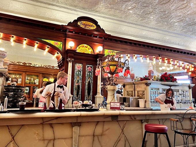 Behind the counter, staff work with the precision of orchestra conductors, creating symphonies of sweetness in vintage glassware.