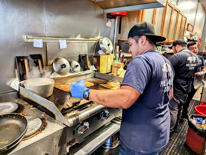 Behind the scenes, where breakfast alchemy occurs. The griddle has probably heard more San Francisco stories than any therapist in town.