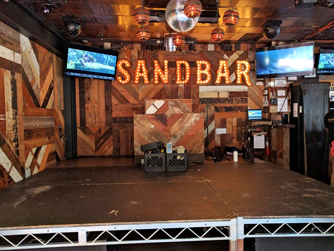 Not just a stage—it's where tequila-fueled karaoke dreams come to life. That illuminated sign has witnessed things it can never unsee.