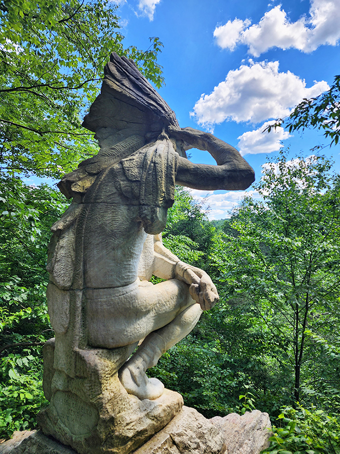 Art meets wilderness: This weathered statue stands sentinel in the forest, looking like it's contemplating whether to order takeout or cook dinner.