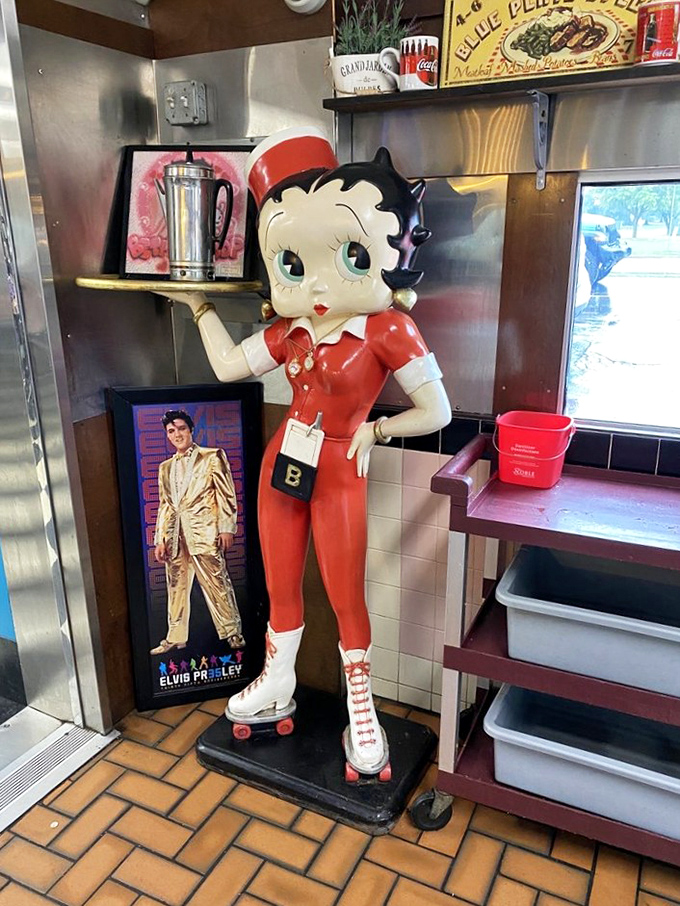 Betty Boop stands guard over breakfast traditions. In the diner hierarchy, she outranks even Elvis, who watches approvingly from below.