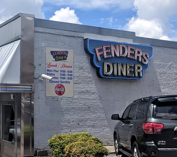 The classic neon-lit exterior announces itself with vintage confidence, a reminder that some institutions don't need trendy makeovers to stay relevant.