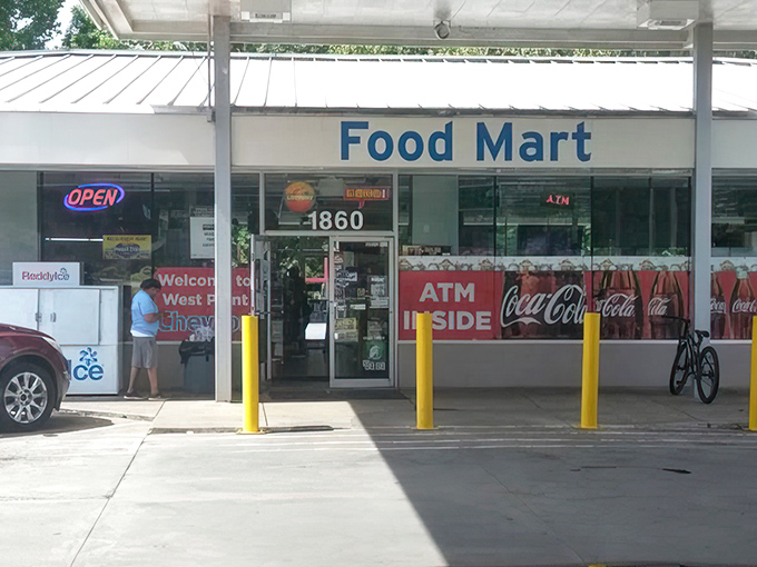 The Food Mart exterior - where locals know to follow their noses past the convenience store facade to chicken paradise.