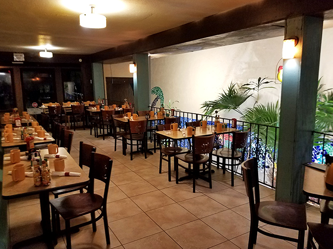 Evening light transforms the dining area into a cozy retreat. Those tables have witnessed first dates, family reunions, and countless "we need to talk" moments.