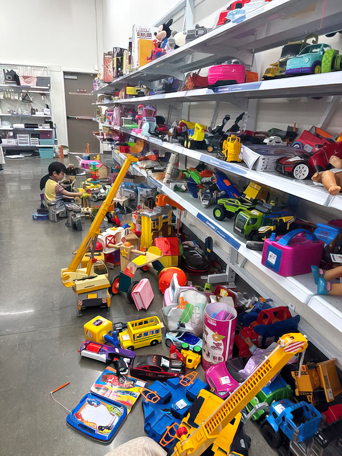 Toy chaos reigns supreme as colorful playthings create joyful disorder across every available surface.