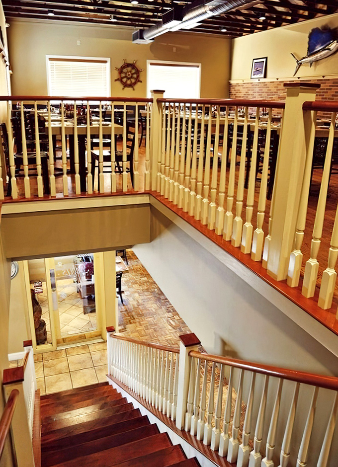 The upper dining area offers a captain's view of the restaurant below&mdash;nautical elegance without having to worry about seasickness.