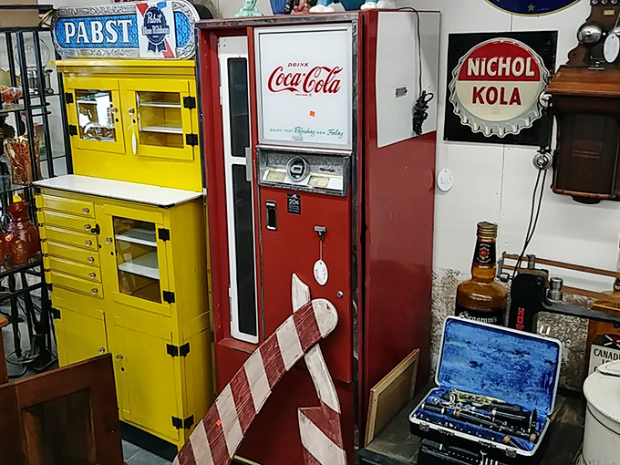 "Pause and refresh" takes on new meaning with this vintage Coca-Cola machine. Standing beside that yellow dental cabinet, it's a technicolor flashback to simpler times.