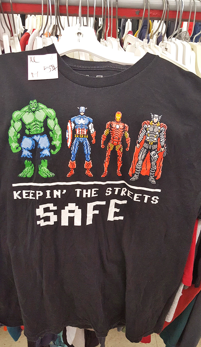 Superhero shirt that perfectly captures thrift store magic: vintage pop culture, unexpected finds, and the power to keep streets safe on a budget.