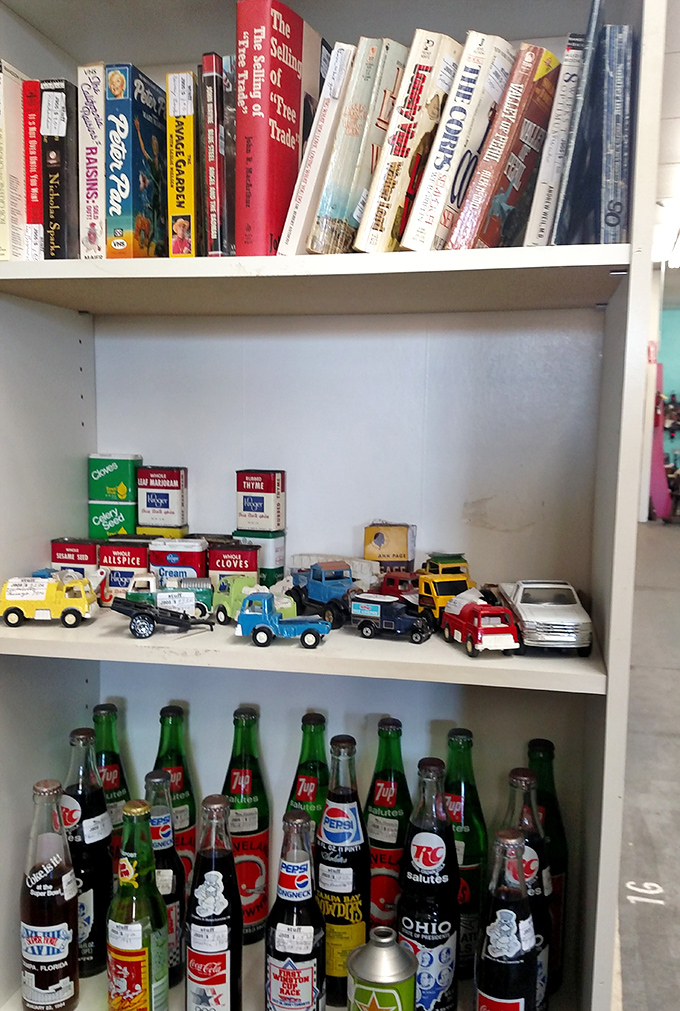 Vintage toy cars parked below nostalgic soda bottles—the perfect recipe for transporting Boomers straight back to Saturday afternoons circa 1962.