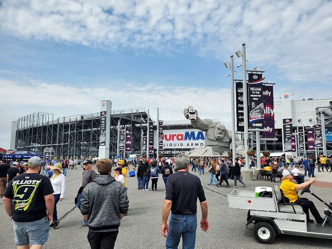 Race day brings the crowds, with Miles standing guard like a benevolent giant watching over his racing kingdom.