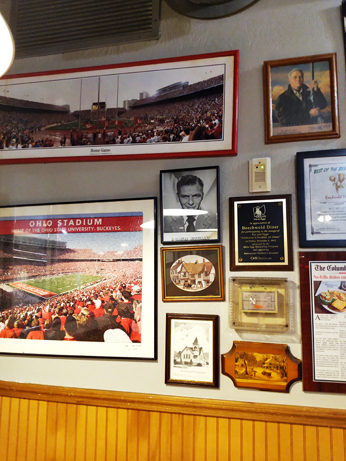 Wall d&eacute;cor that tells you everything: this place loves Columbus, respects tradition, and has earned every framed accolade.