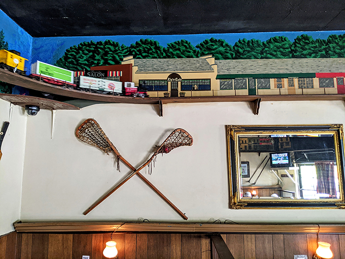 Look up and you'll spot the model train chugging along its track, while vintage lacrosse sticks cross in silent tribute to local sports heritage.