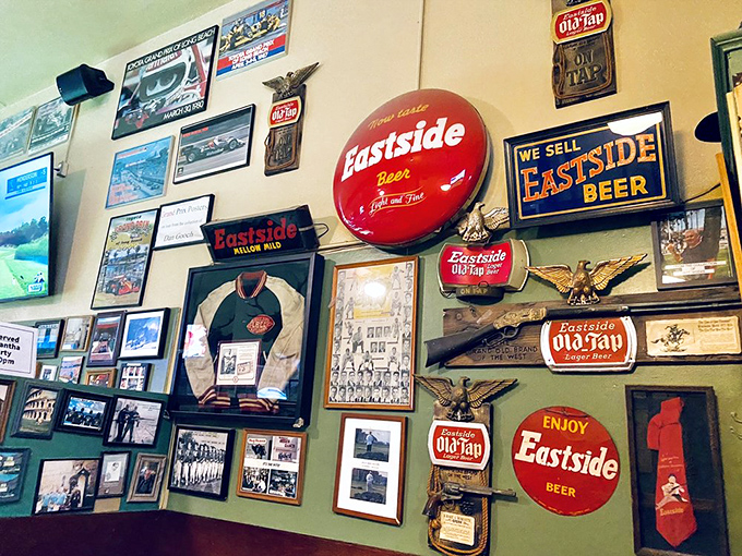 Every faded sign and vintage advertisement tells a story on these walls, creating a living museum of beer history that no interior designer could authentically replicate.
