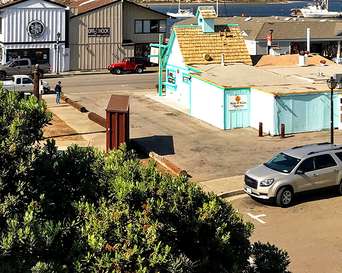 Colorful storefronts along the waterfront offer everything from fresh fish to trinkets that somehow seem essential when sea air fills your lungs.