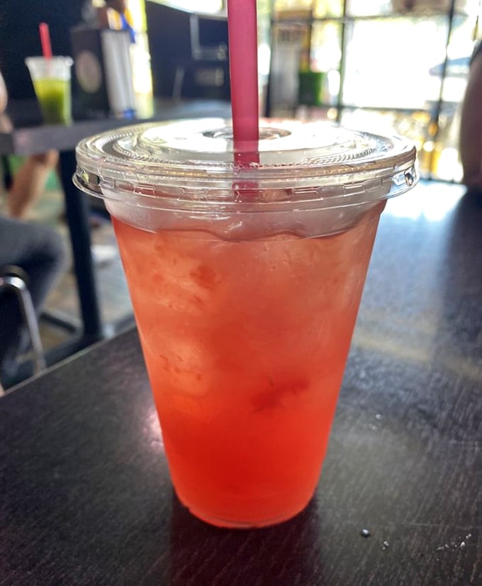 The jamaica agua fresca glows like a ruby sunset in a cup—tart, sweet, and the perfect antidote to spice-induced heat.