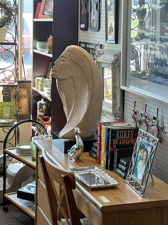 Art deco meets contemporary in this corner where a sculptural profile commands attention among carefully curated books and frames.