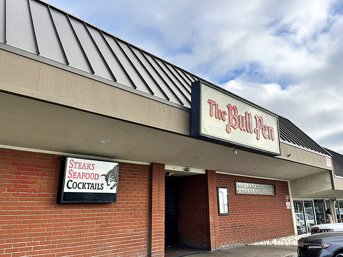 The Bull Pen's classic sign promises old-school steakhouse perfection that hasn't changed since your parents' first date.