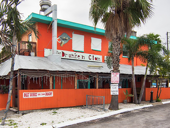 The Drunken Clam's bright orange exterior stands out like a tipsy tourist who forgot their sunscreen.