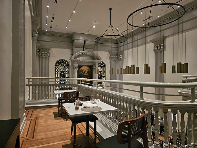 Second-floor seating offers elevated views of the dining spectacle below, literally taking dinner to new heights.