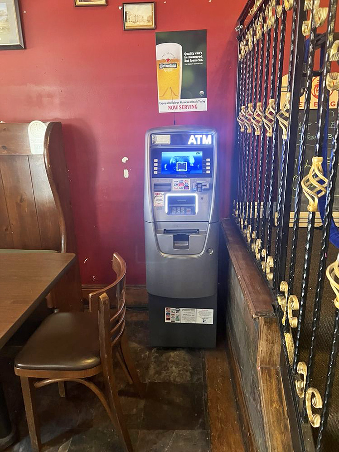 Even the ATM looks at home against the red wall – because after tasting that Shepherd's Pie, you'll want cash for another round.