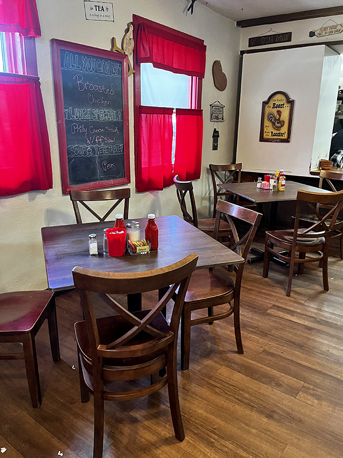Red curtains frame windows like theater drapes, setting the stage for the daily performance of "People Enjoying Real Food: The Musical."